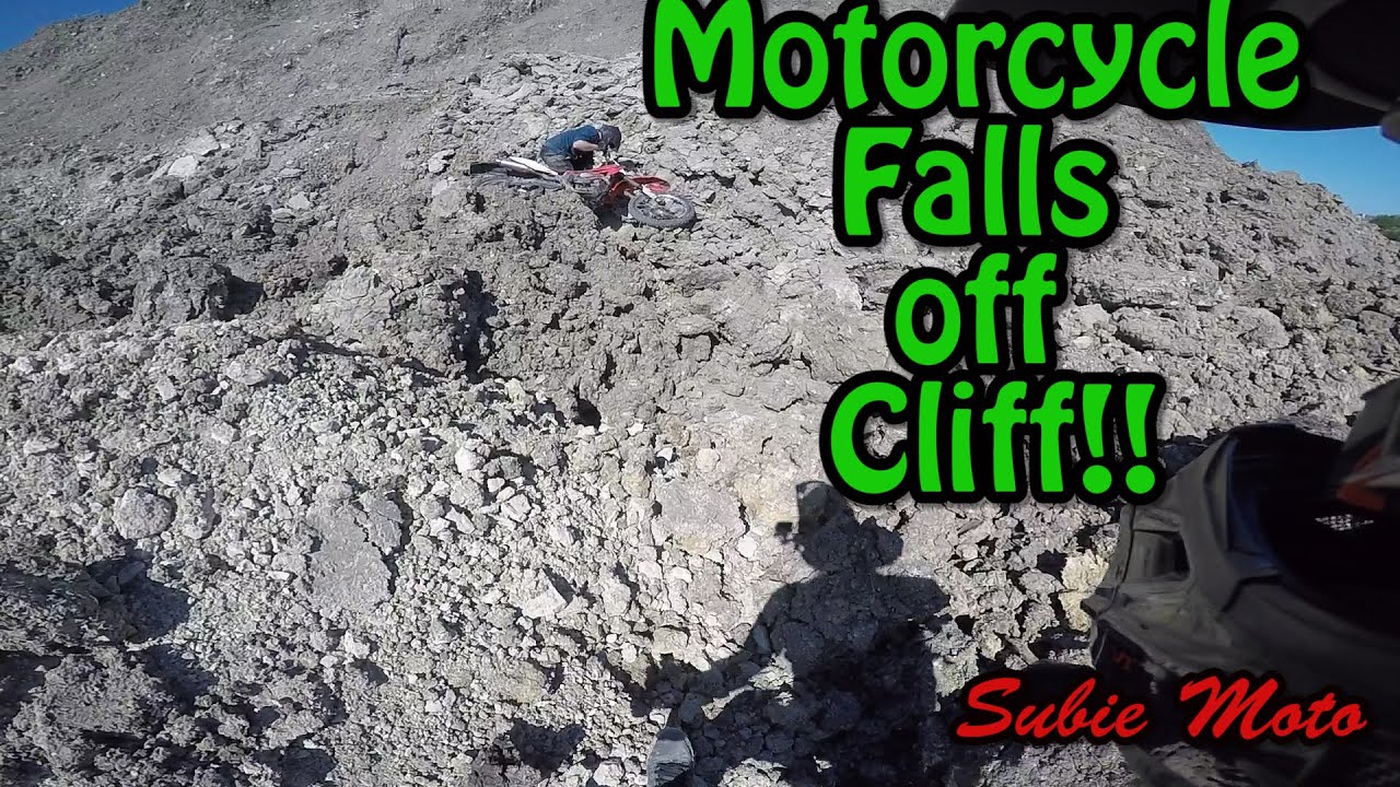 Motorcycle falls off dirt cliff! - YouTube