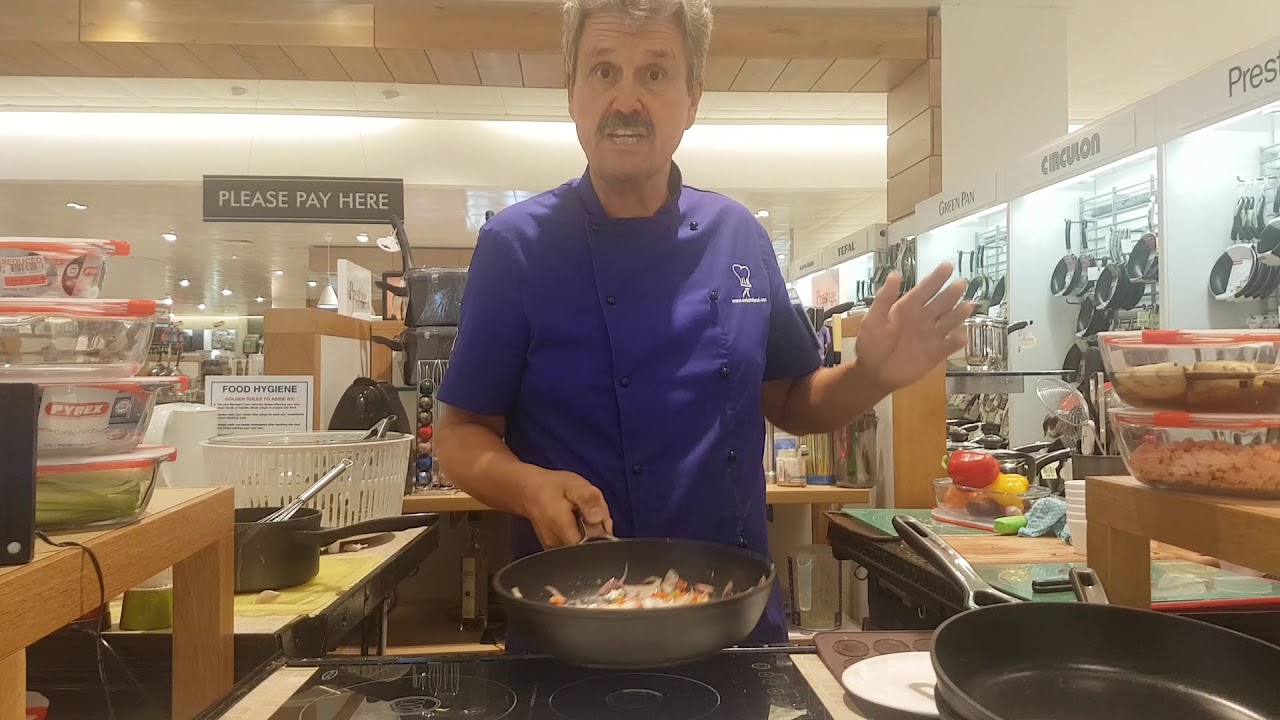 Tossing food in a non-stop pan - YouTube
