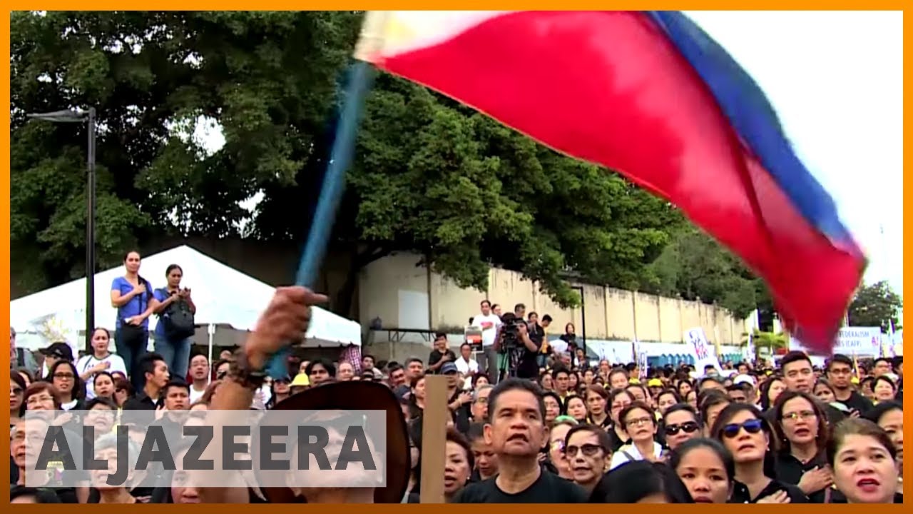 🇵🇭 Philippines protesters mark 32nd anniversary of People Power - YouTube