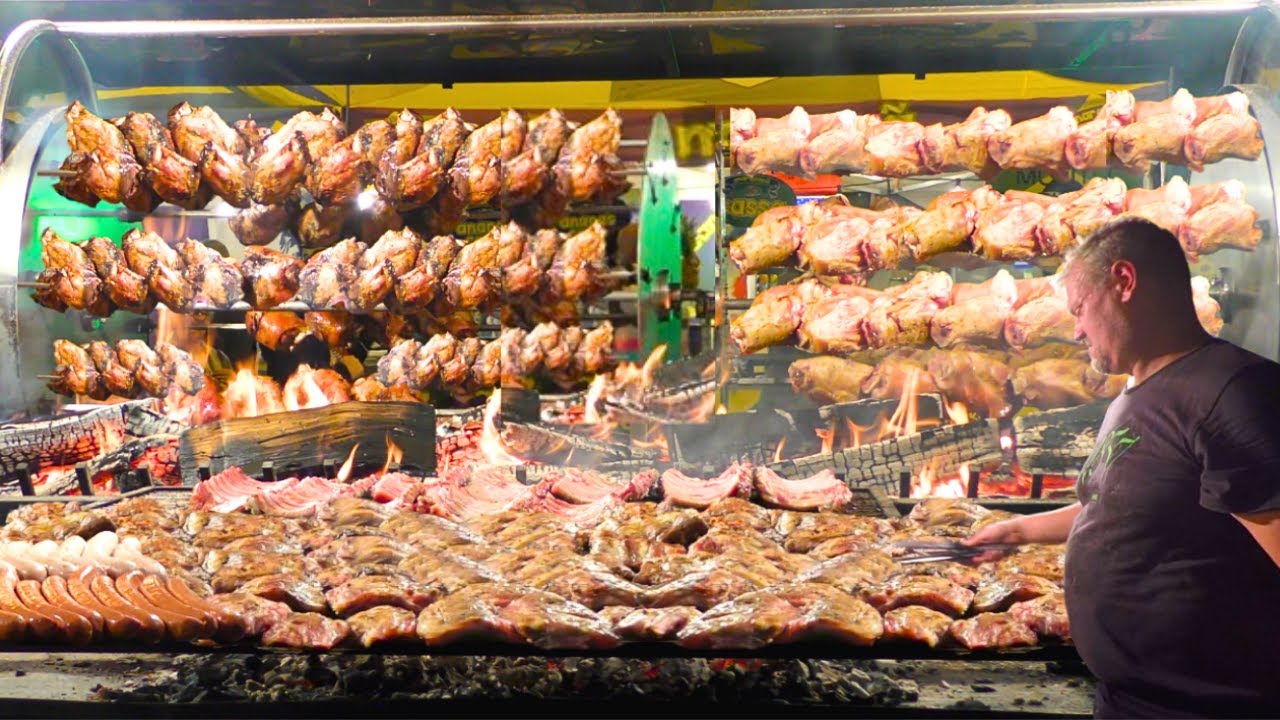 German Street Food. Rotating Machine Roasts Tons of Pork Knuckles, Ribs ...