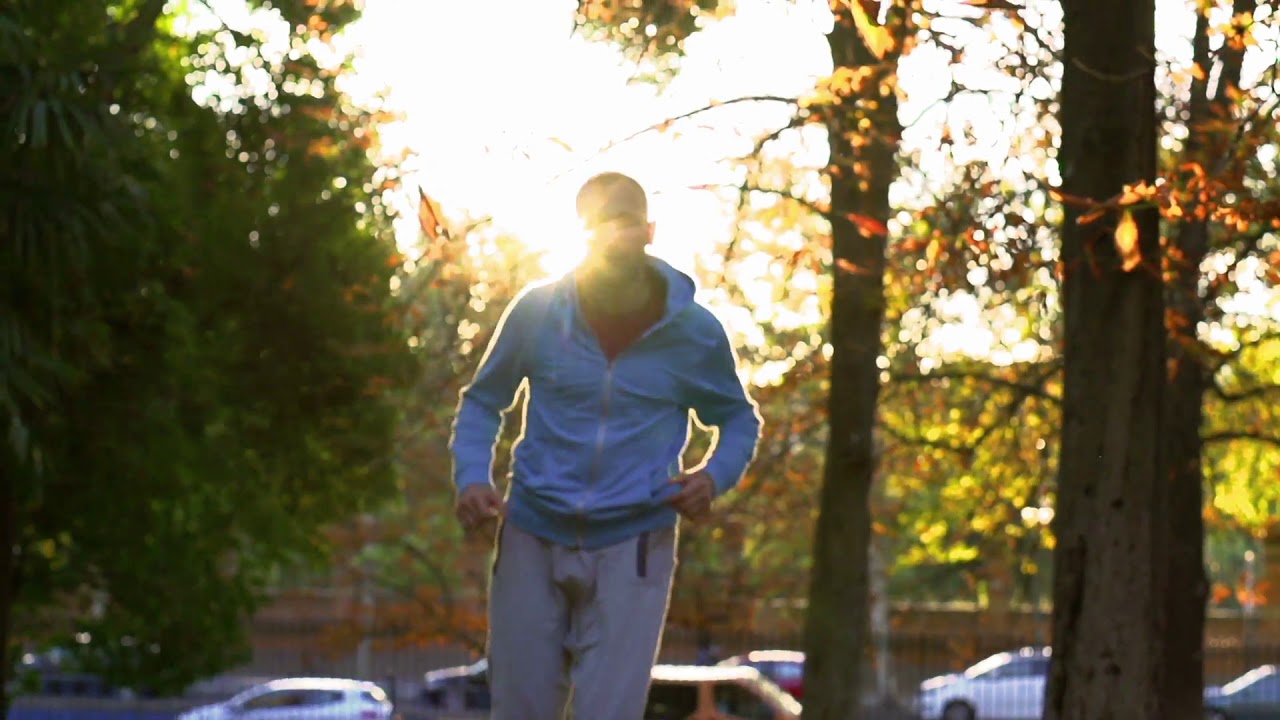man running in the sunlight slow motion shot steadycam - YouTube