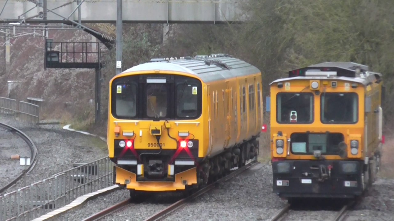 NR's Sprinter 950001 passes over the Concrete Cows and Rail Grinder at ...