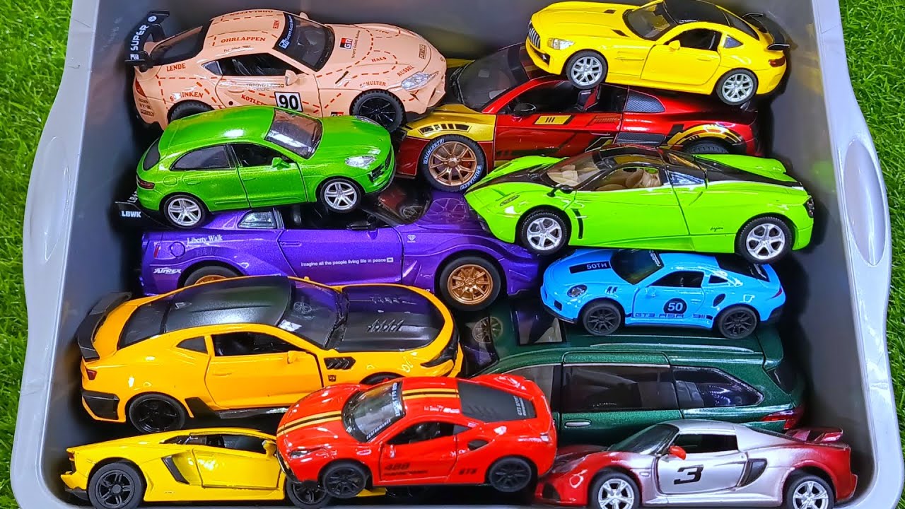 Box full of various miniature cars Peugeot, Maserati, Pagani, Cadillac ...