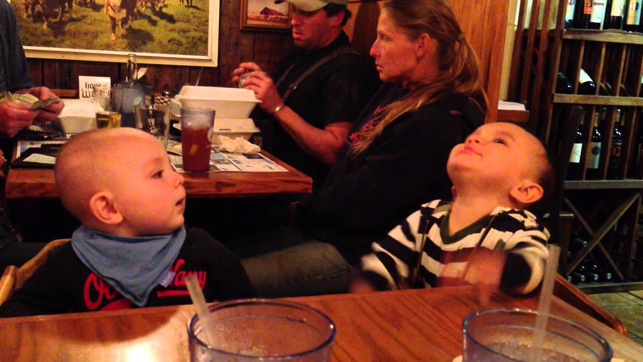 Ethan and Noah playing at the restaurant - YouTube