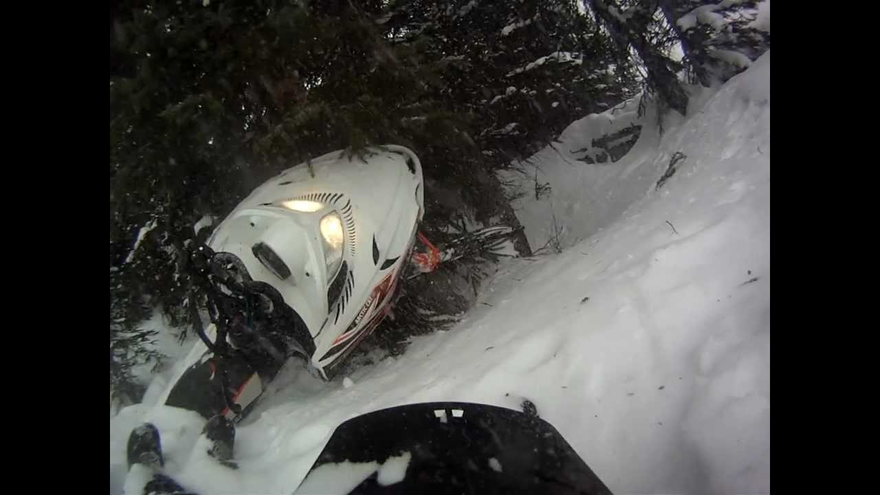 Snowmobiler hits tree - YouTube