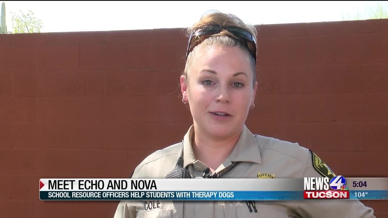 SRO Officers help students with Therapy Dogs - YouTube
