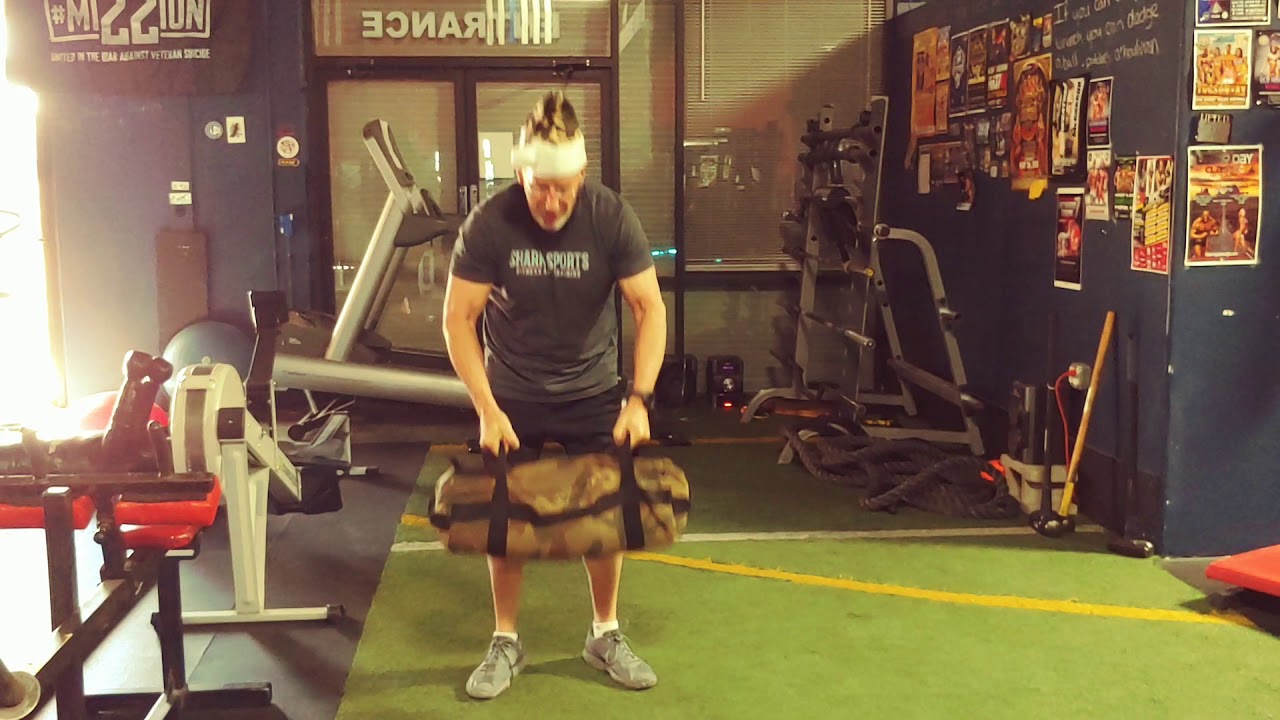 Burpee sandbag ground to overhead - YouTube
