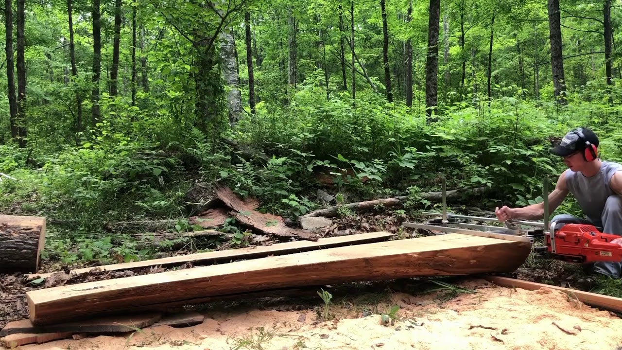 395 milling tamarack log - YouTube