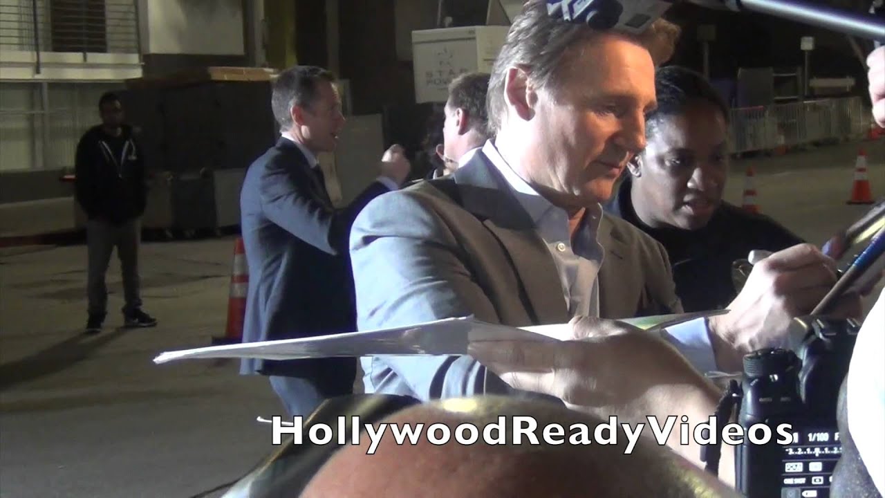 Liam Neeson greets fans arriving at the Non Stop premiere in Westwood ...