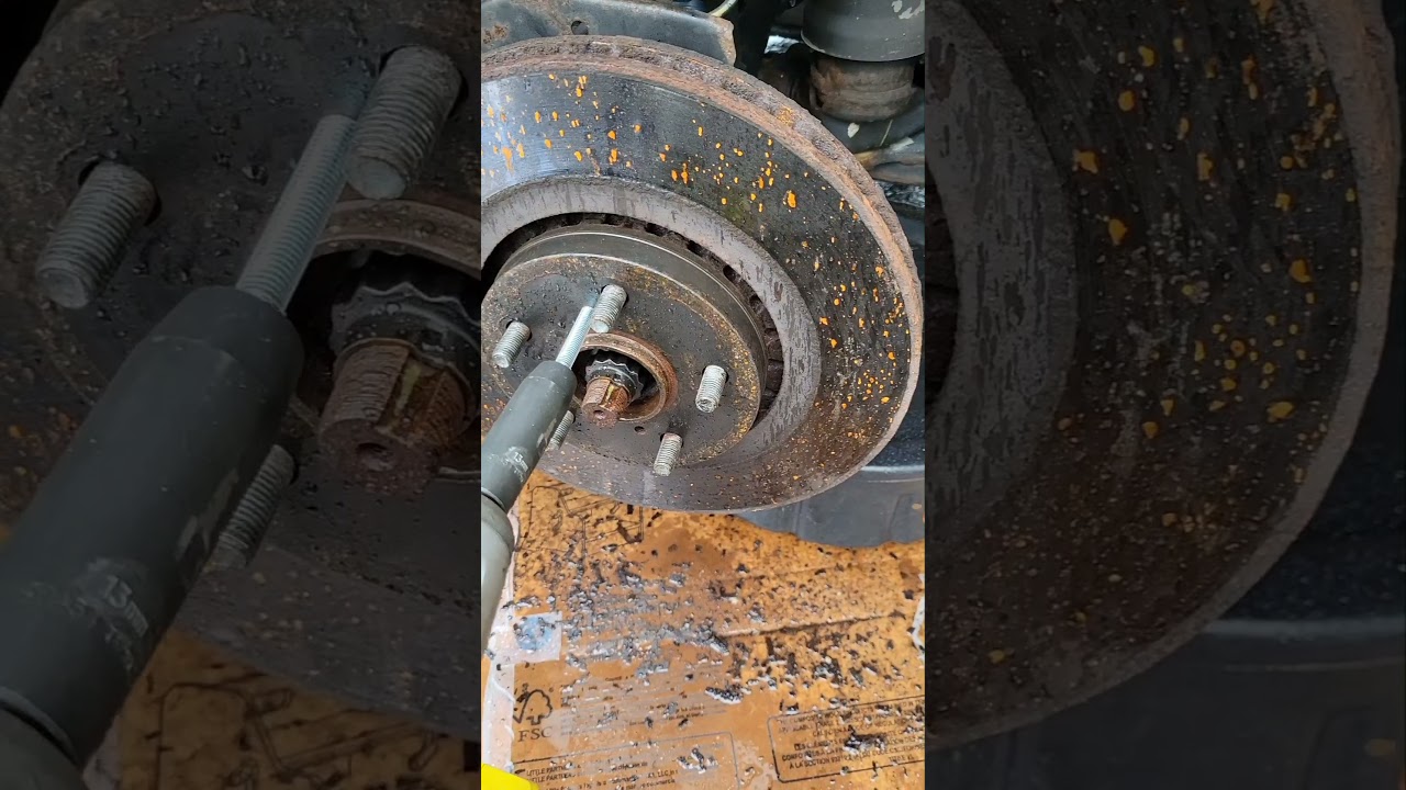 removing a stuck rotor with a bolt - YouTube