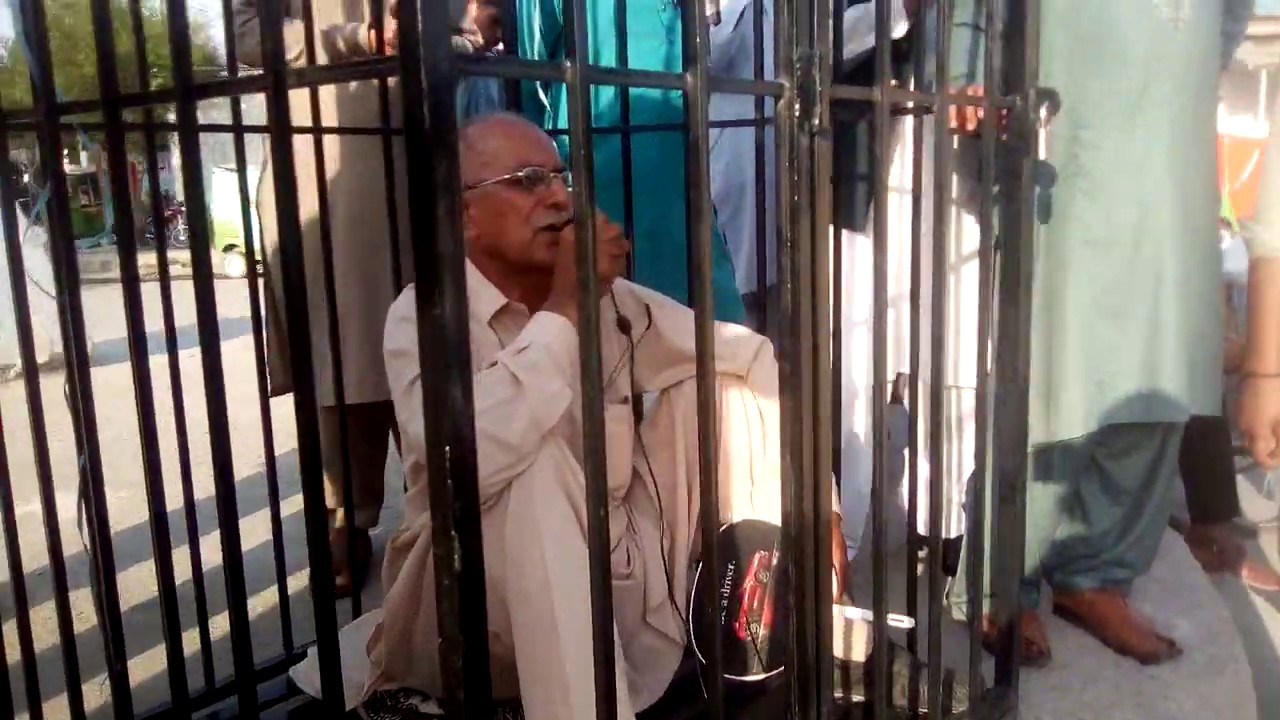 Cage protest an old man lock himself in cage in a protest. - YouTube
