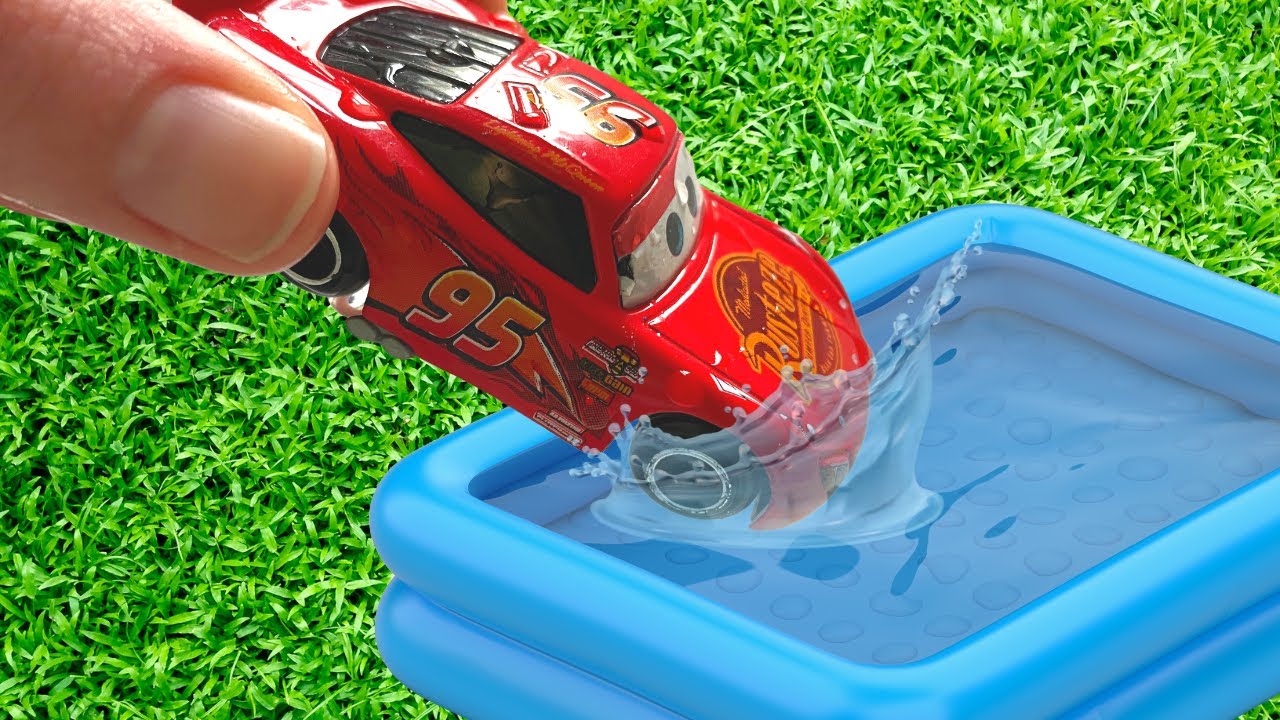 Pixar Cars Lightning McQueen and Tow Mater and more slide into pool of ...