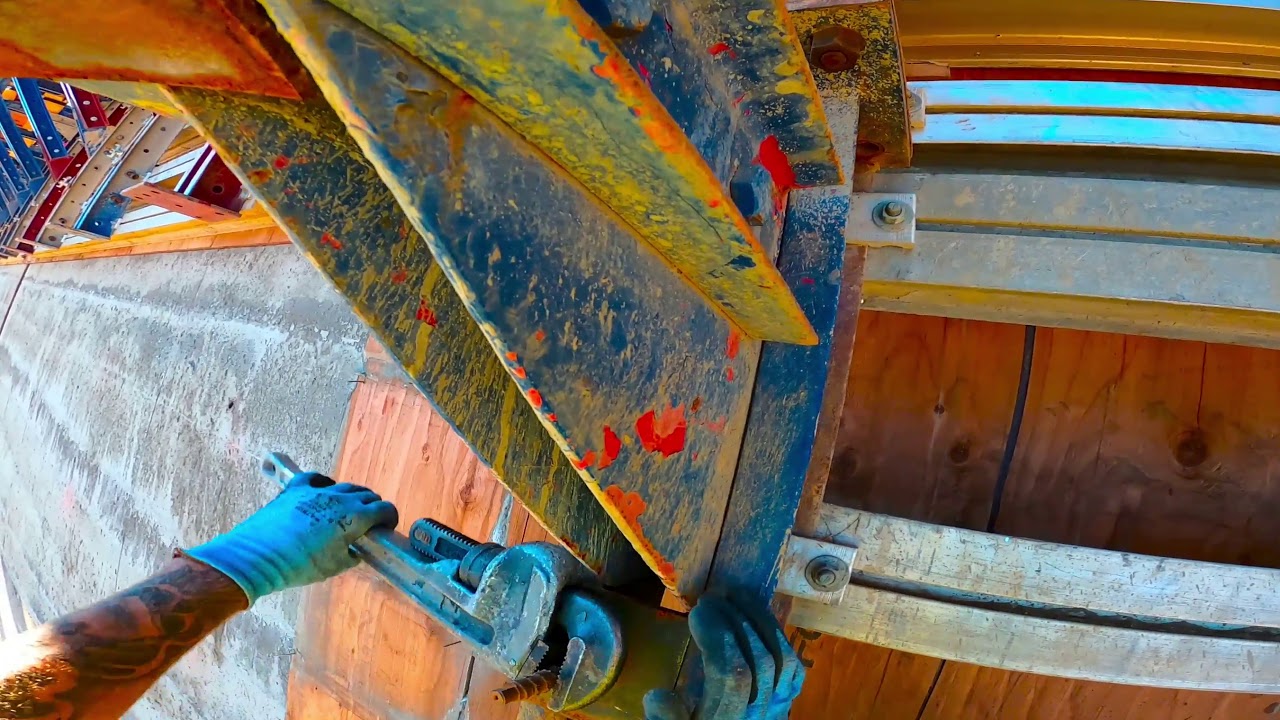 stripping A S I formwork at site c dam - YouTube