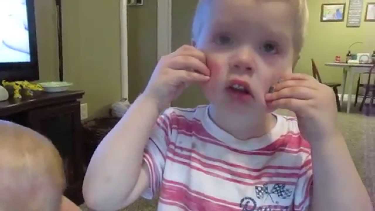 J pinching his cheeks being silly - YouTube