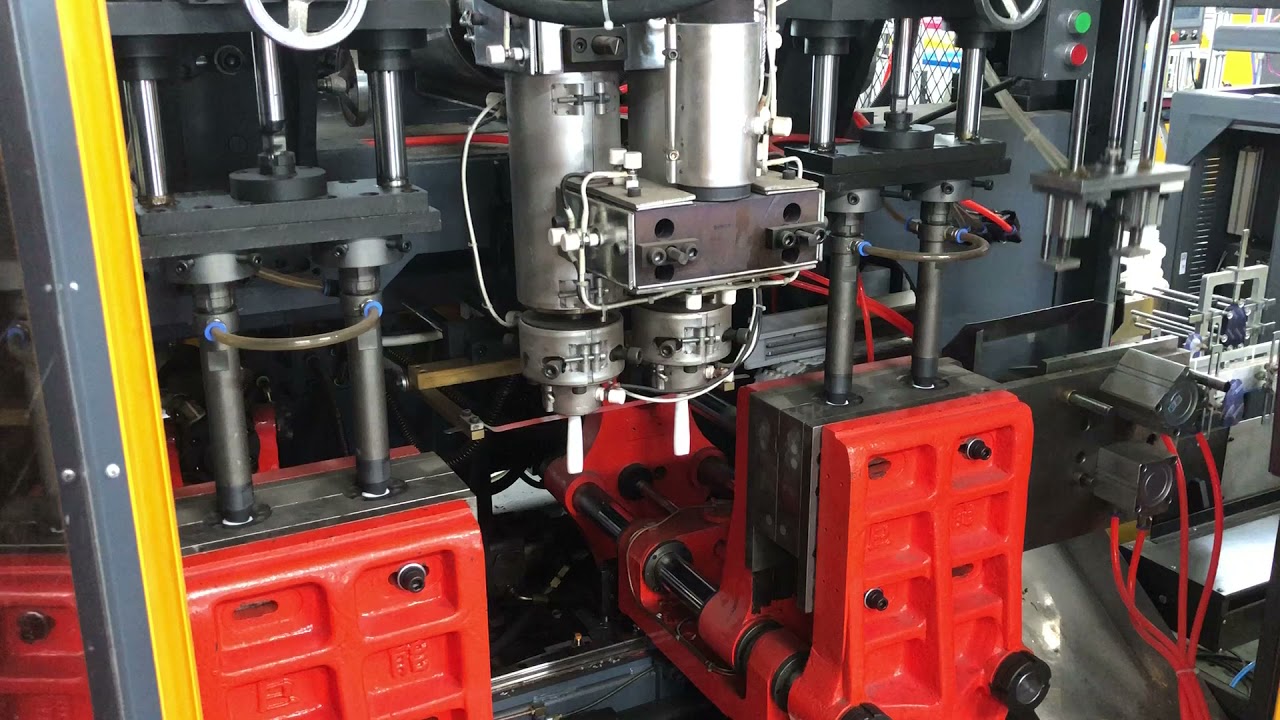 2 cavity small bottle inside mould labeling blow molding machine - YouTube