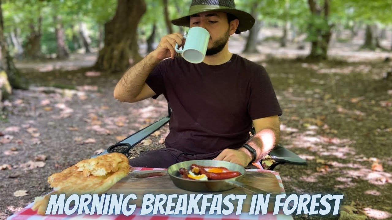 Cooking a Peaceful Forest Breakfast Over an Open Fire on a Serene ...