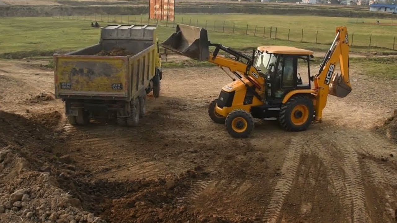 JCB Backhoe Loader Loading Sand On Dump Truck - YouTube