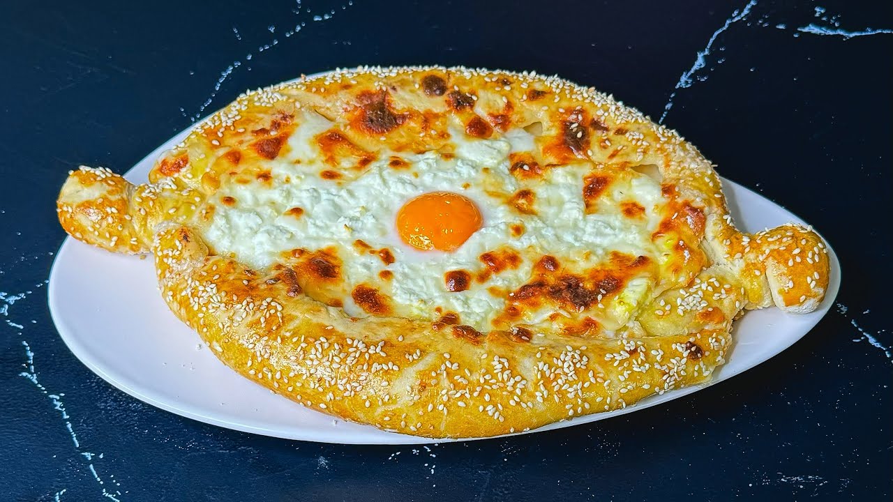 Adjaruli Khachapuri - Traditional Georgian Cheese Bread boat in the ...