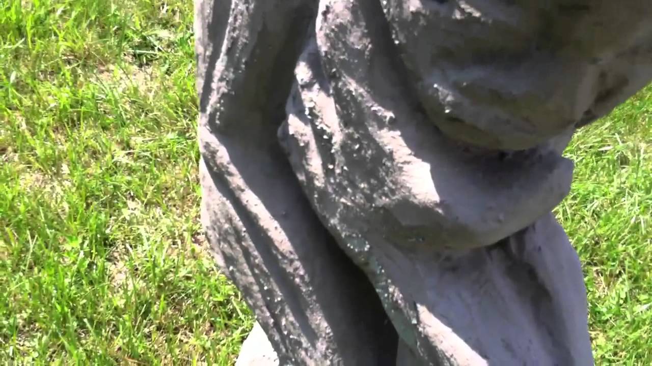 Concrete man lawn sculpture - YouTube