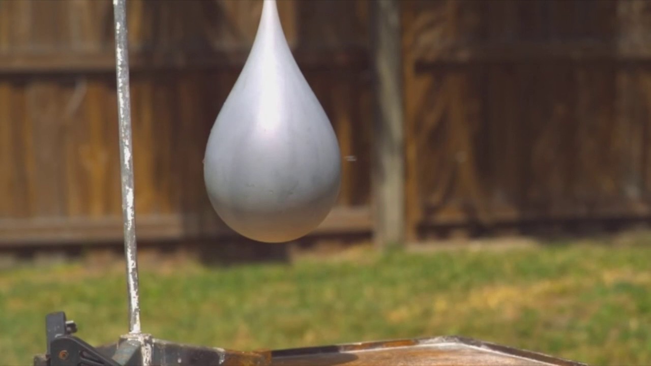 WATER BALLOON HIT BY BULLET - YouTube