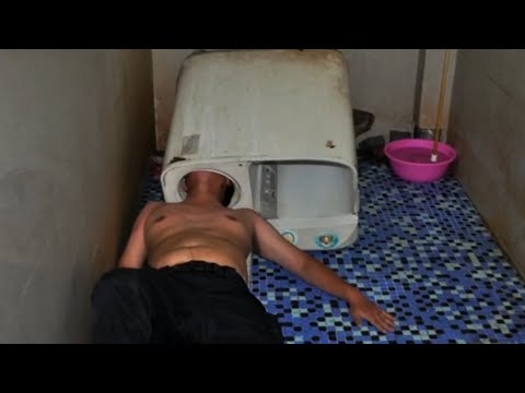 Başını təmir üçün paltaryuyana soxdu ilişib qaldı