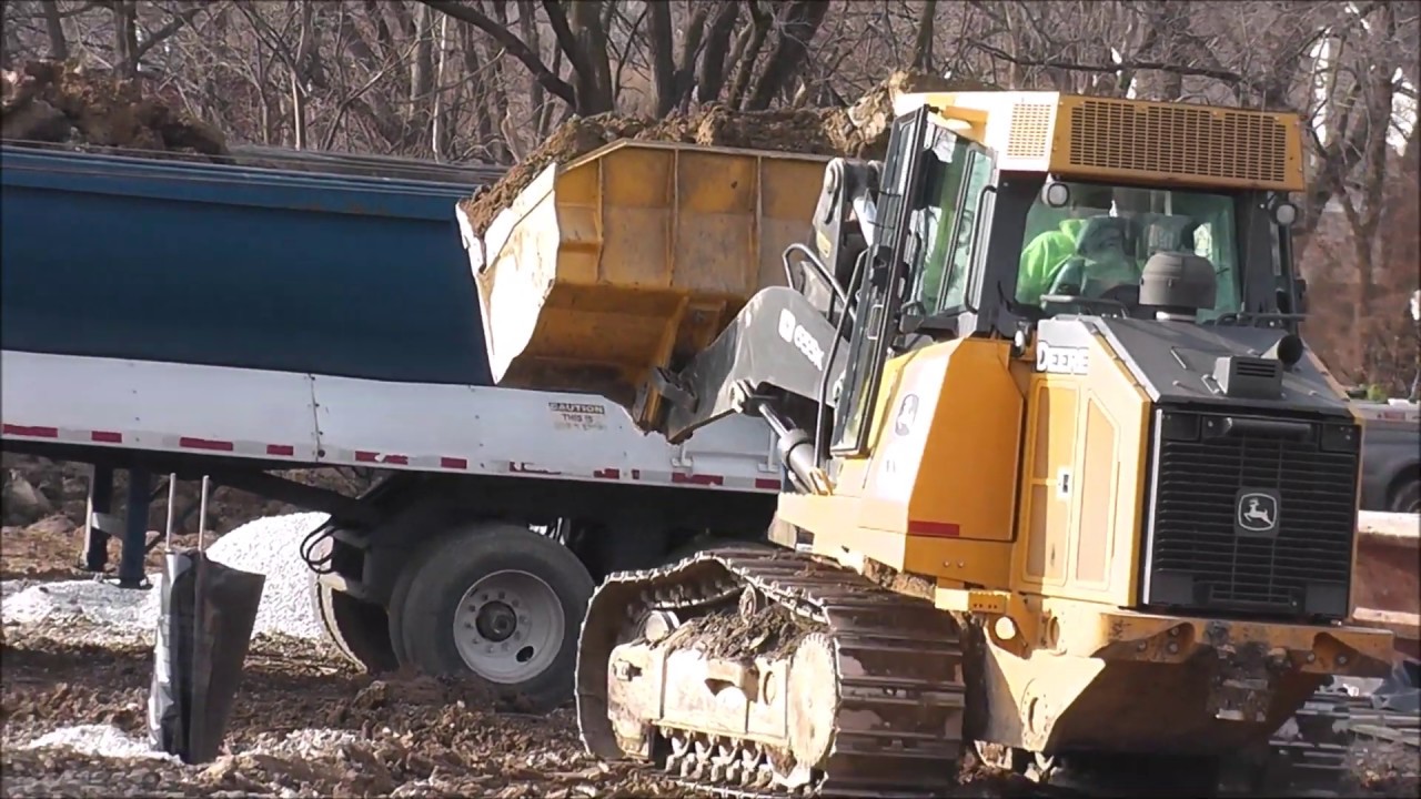 Track Loader and Excavator Combo In Action Digging Moving Dirt | John ...