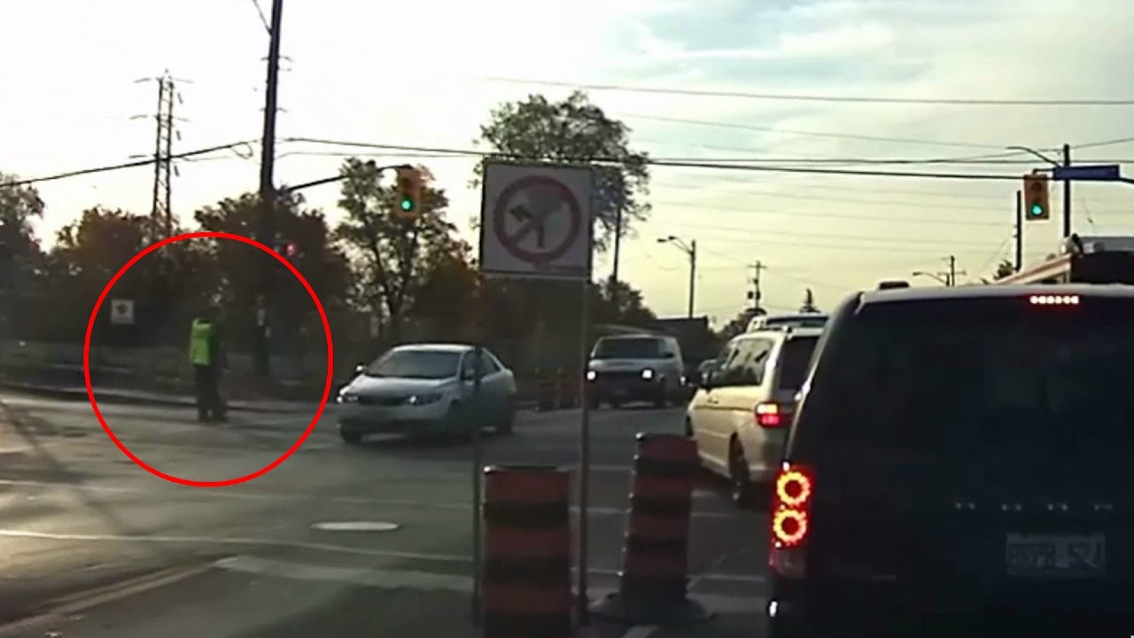Van attempts illegal left turn right in front of Toronto police officer ...