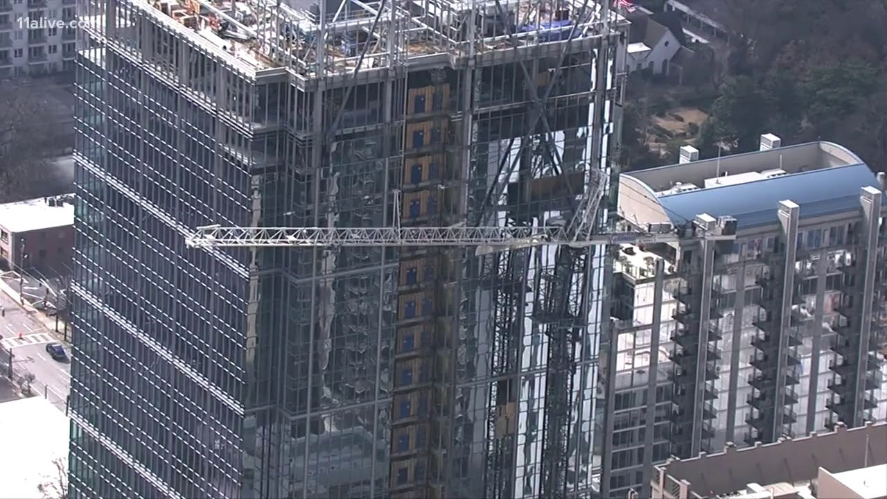Video shows unstable crane leaning into Midtown Atlanta building - YouTube