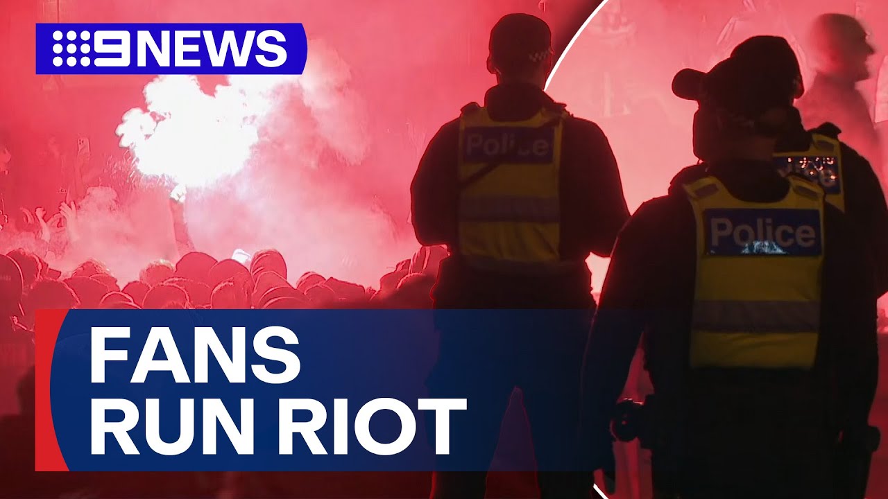 Tensions reach boiling point as fans throw flares at riot police in ...