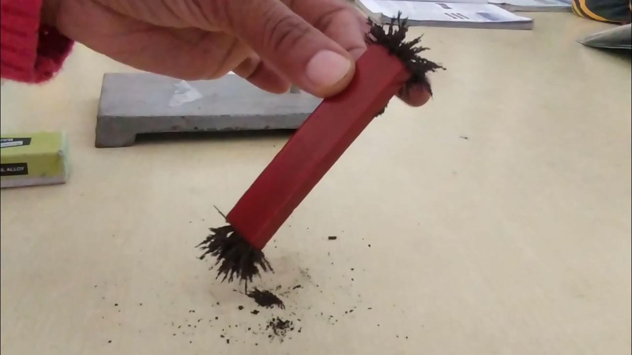 Iron filings sticking to a bar magnet more at the poles - YouTube