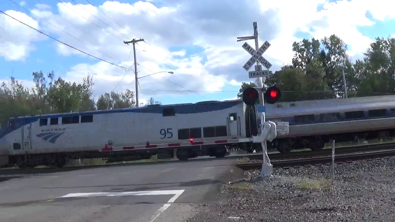 Amtrak train Crosses railway crossing - YouTube