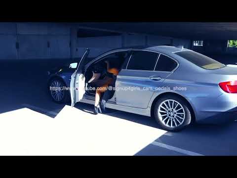 Pedal pumping BMW in black heels