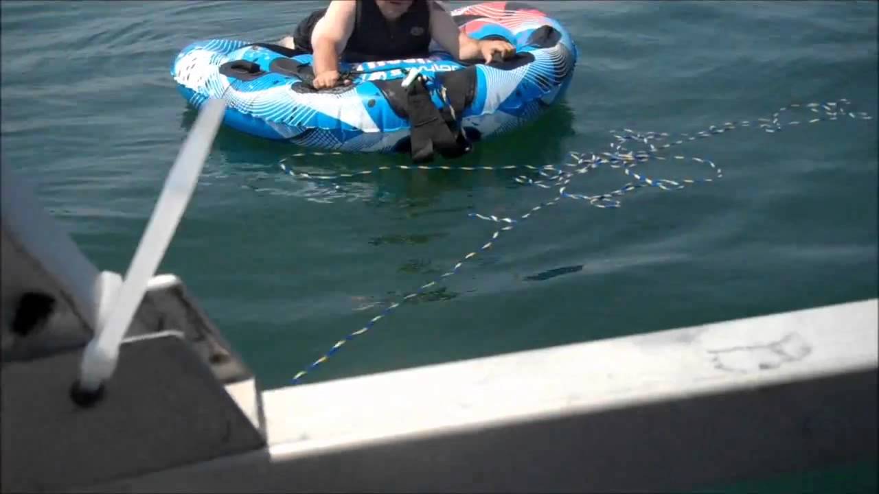 Fat Guy trys to water ski on a raft pulled by boat - YouTube