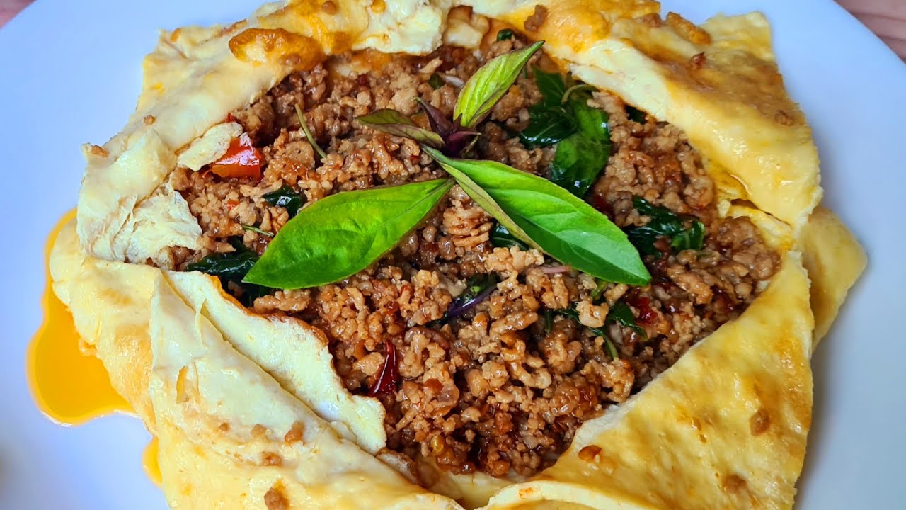 Thai stuffed omelette ( stir-fried minced pork with sweet basil inside ...