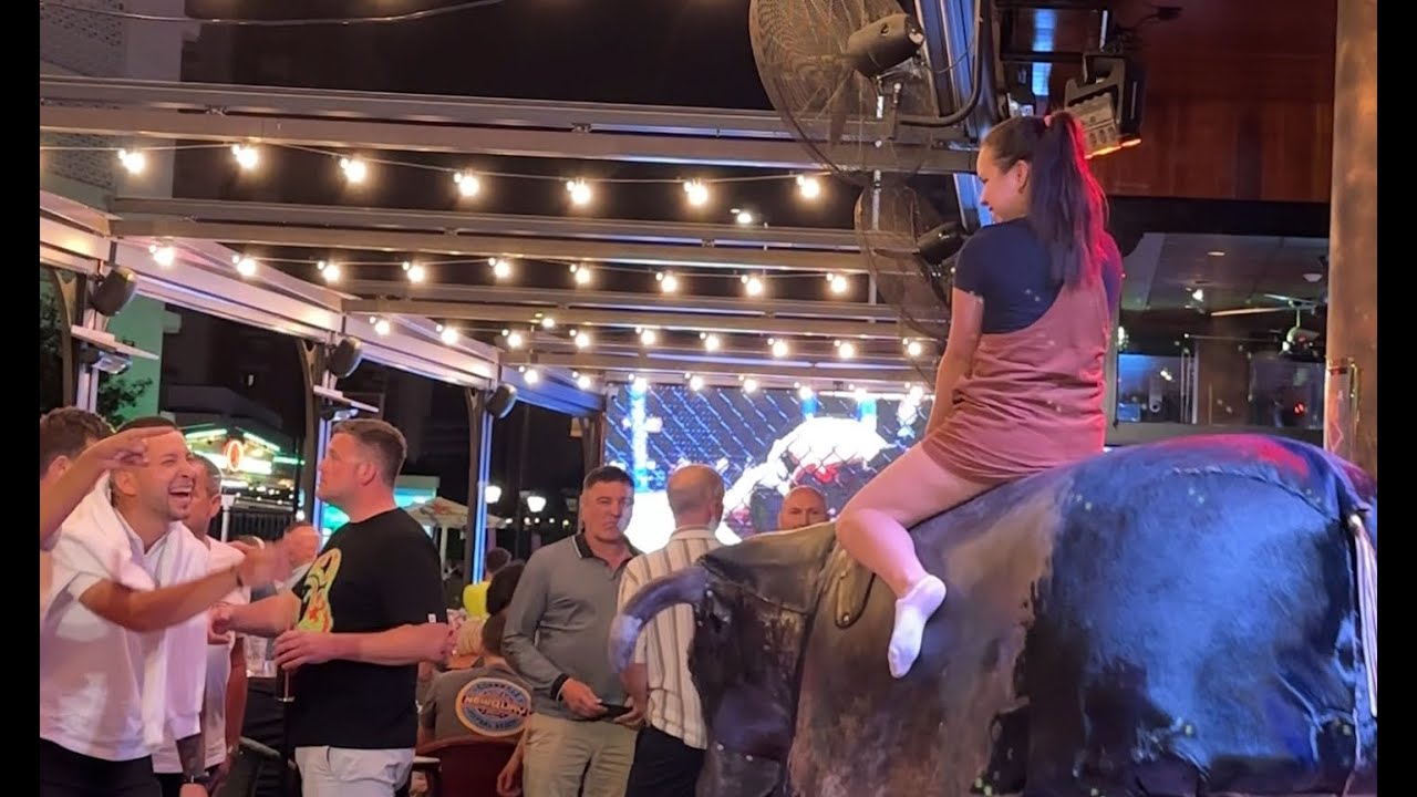 Girl in beautiful dress Riding on a Bull in Benidorm - YouTube