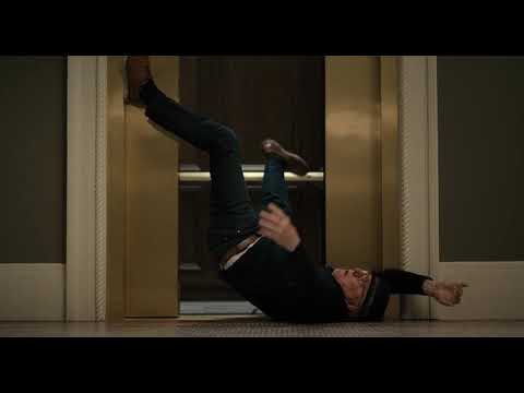 A drugged Charles/Steve Martin struggling to get in an elevator