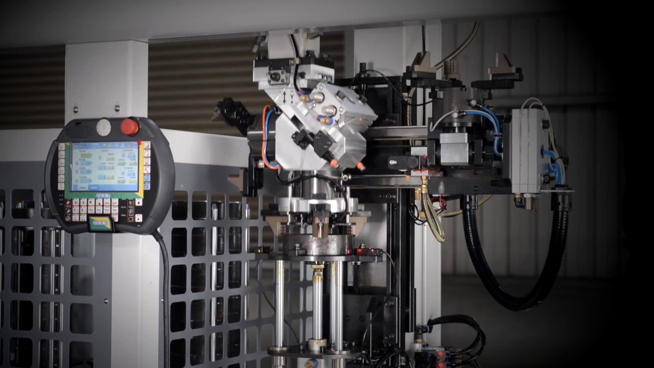 Dual gantry loaders for continuous workpiece loading on CNC lathes ...