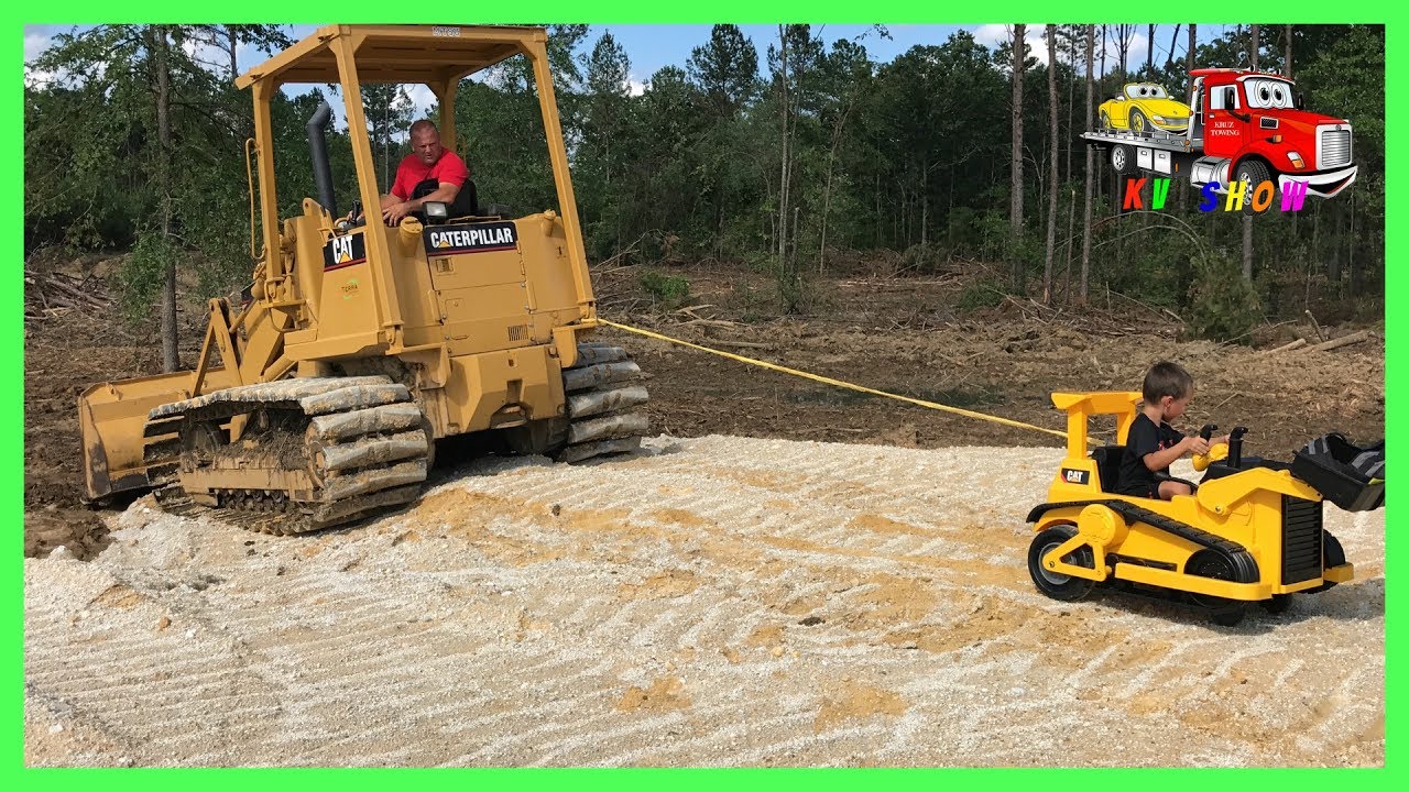 Kruz Helping Dada Powered Ride On Bulldozer Pulling Out The CAT Track ...