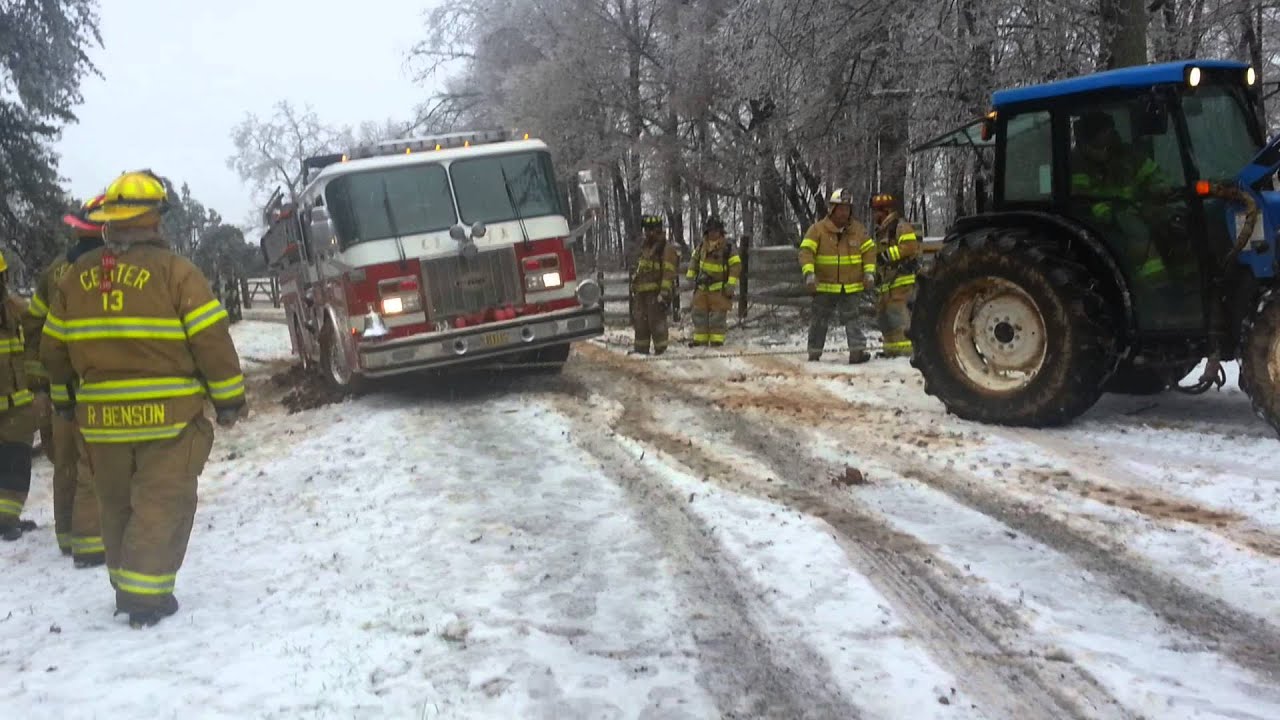 ice storm fire truck stuck tractor pulling it free - YouTube