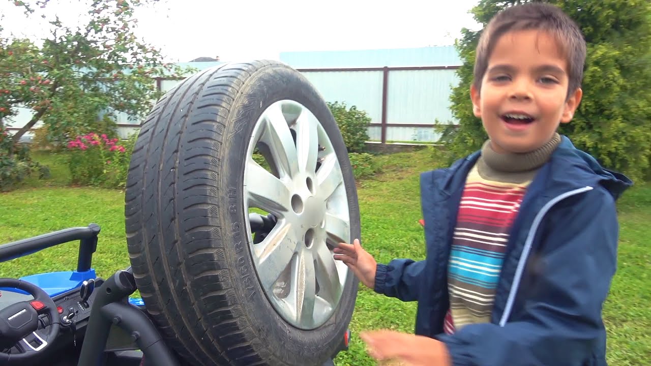 children play with cars and put a big wheel - YouTube