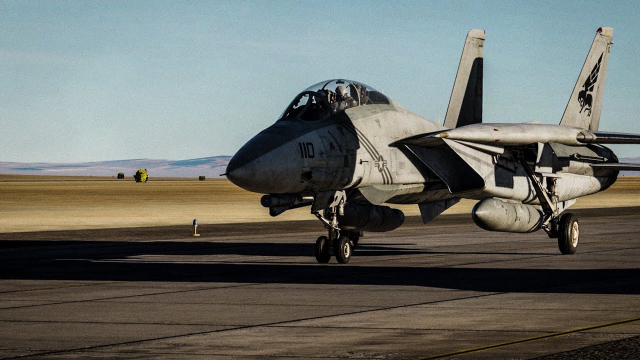 F-14B Tomcats from Strike Fighter Squadron VF-143 "Pukin Dogs" taxi out ...