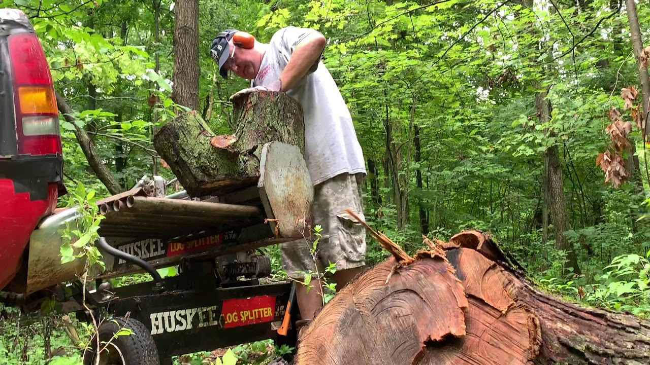 How to split hickory firewood blocks in woods using Huskee log splitter ...