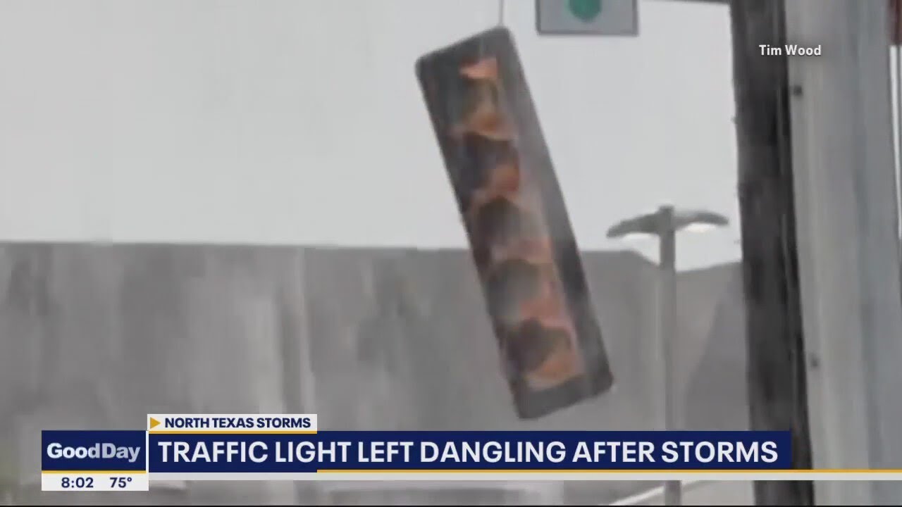 Lewisville traffic light left dangling after storms - YouTube