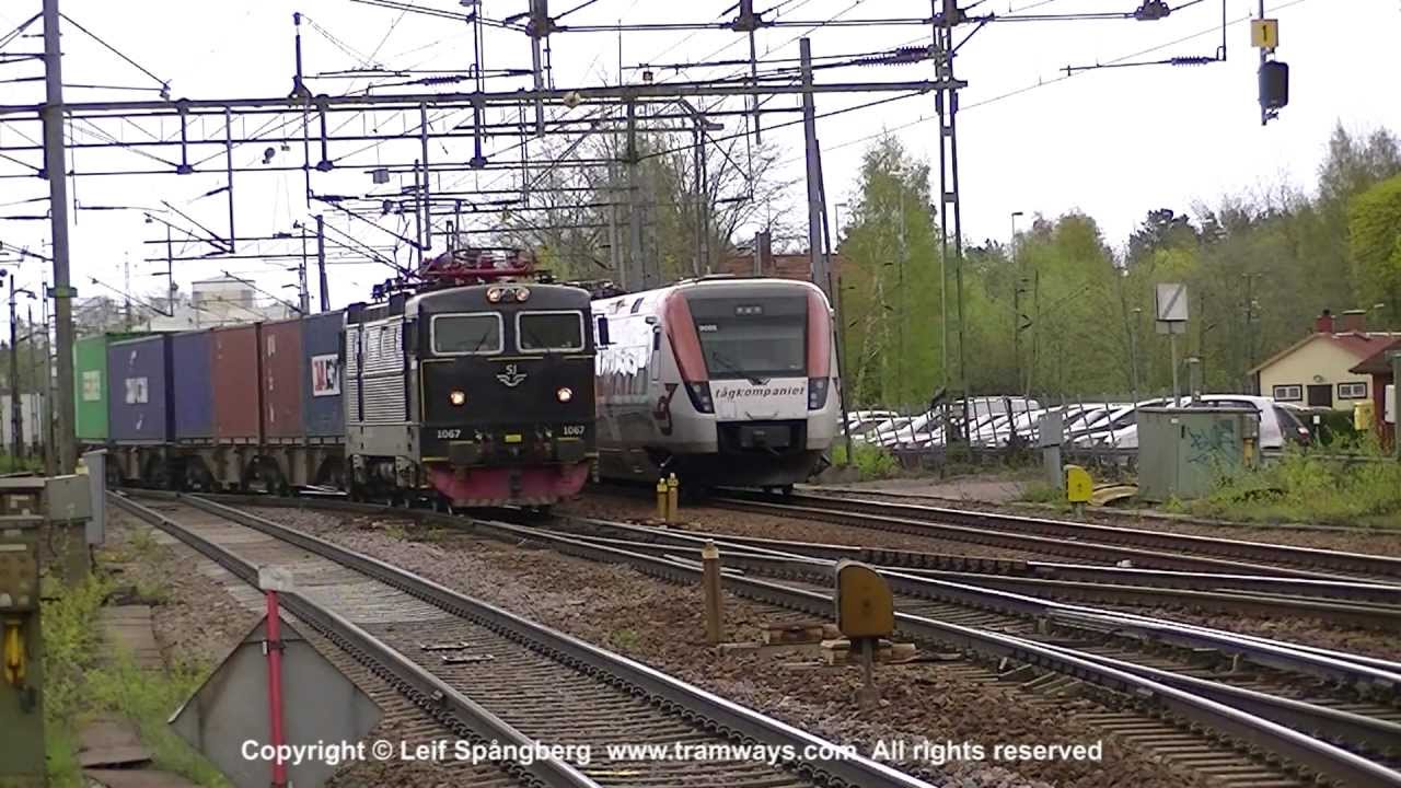 SJ Rc3 1067 with freight train in Hallsberg, Sweden - YouTube