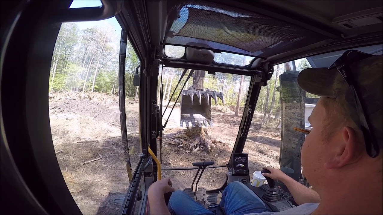 Loading Stumps Into Dump Trucks - YouTube