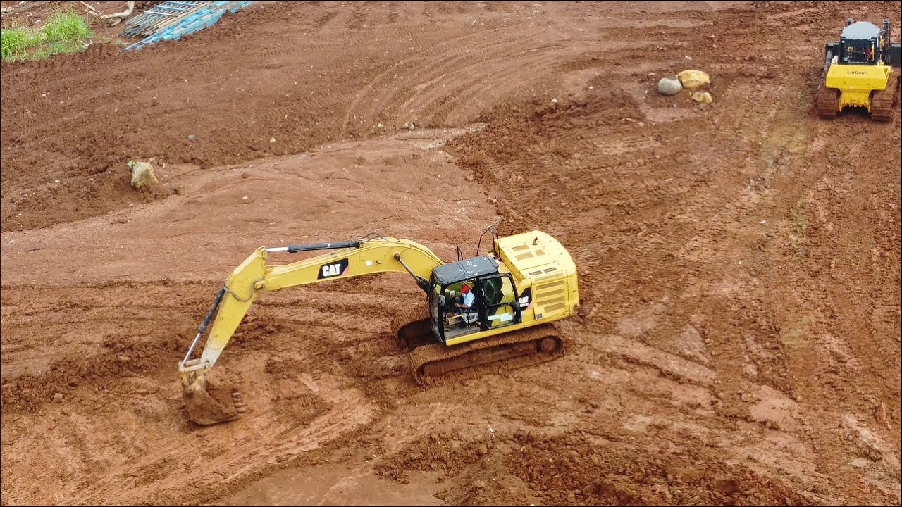 DRONE FOOTAGE EXCAVATOR AND BULLDOZER WORKING ON ROAD CONSTRUCTION ...