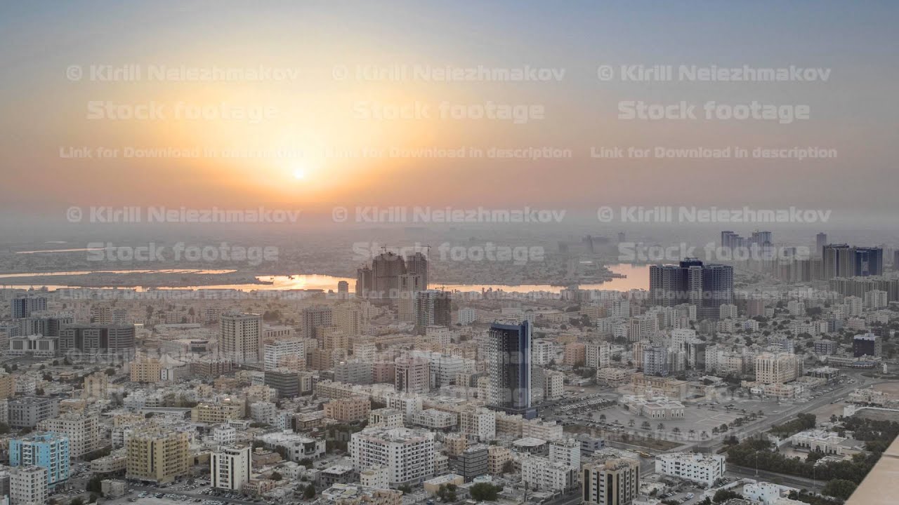 Sunrise with Cityscape of Ajman from rooftop timelapse. Ajman is the ...