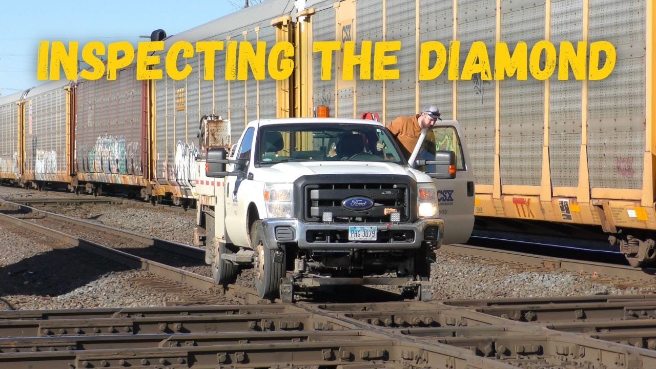 inspecting the diamonds as a super long M216 CSX auto-racks train works ...