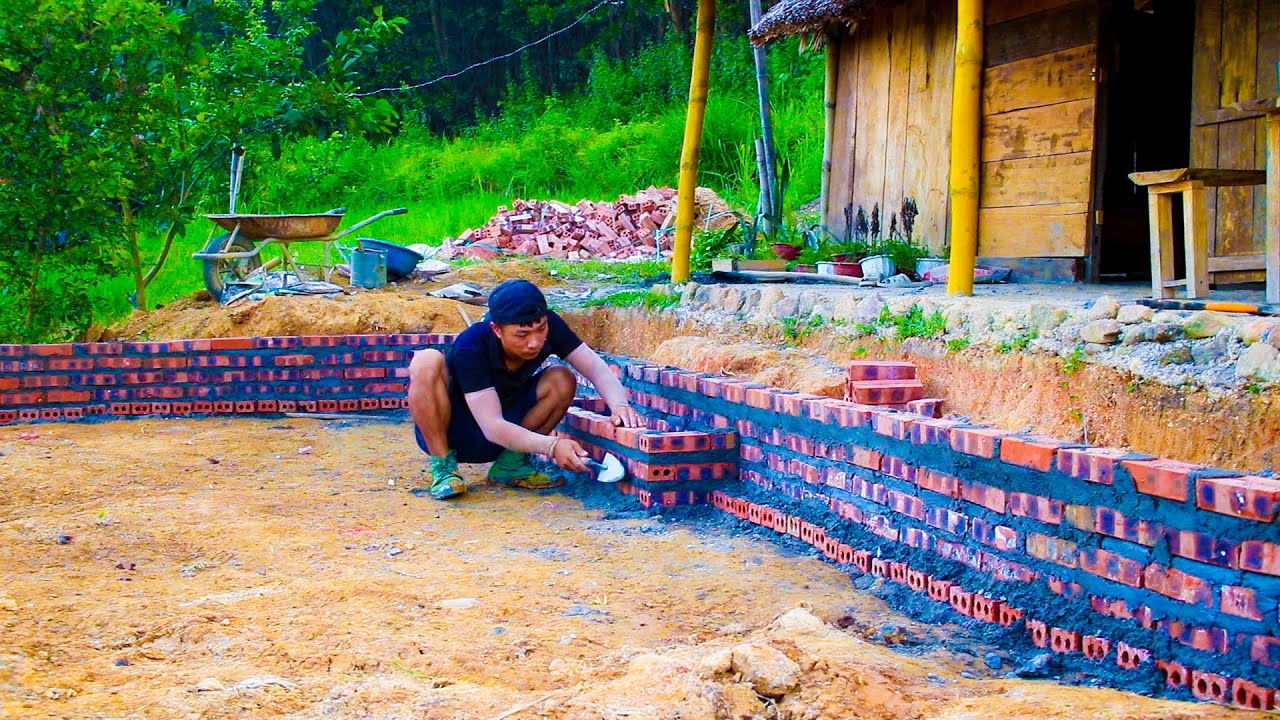 Digging the ground alone, building stairs for wooden cabins - Building ...