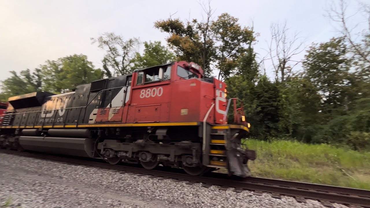CN 8800 leads a long and heavy U702 in Plum, PA with a horn salute ...
